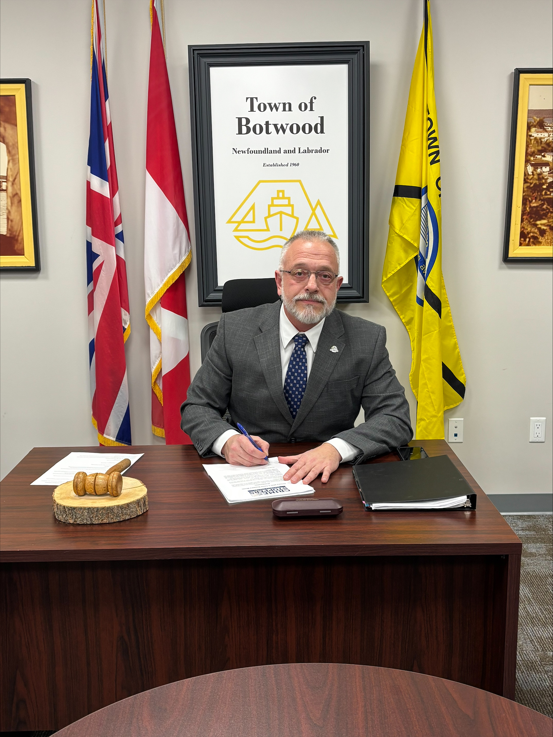 Deputy Mayor Jim Hancock signing a proclamation designating January to ...